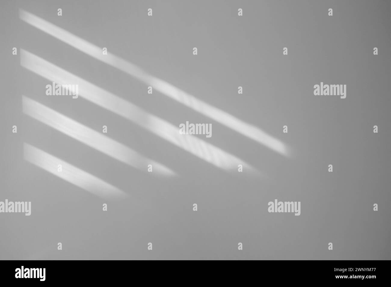 Light and shadows falling on white wall Stock Photo - Alamy