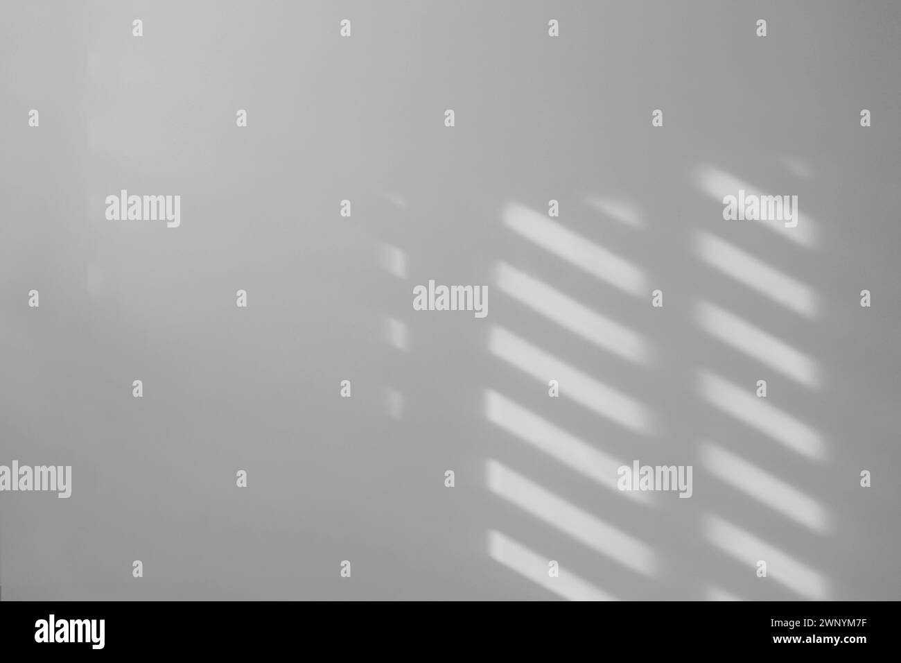 Light and shadows falling on white wall Stock Photo - Alamy