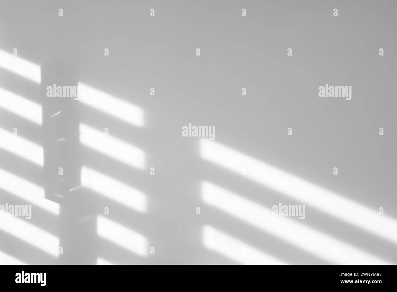 Light and shadows falling on white wall Stock Photo - Alamy