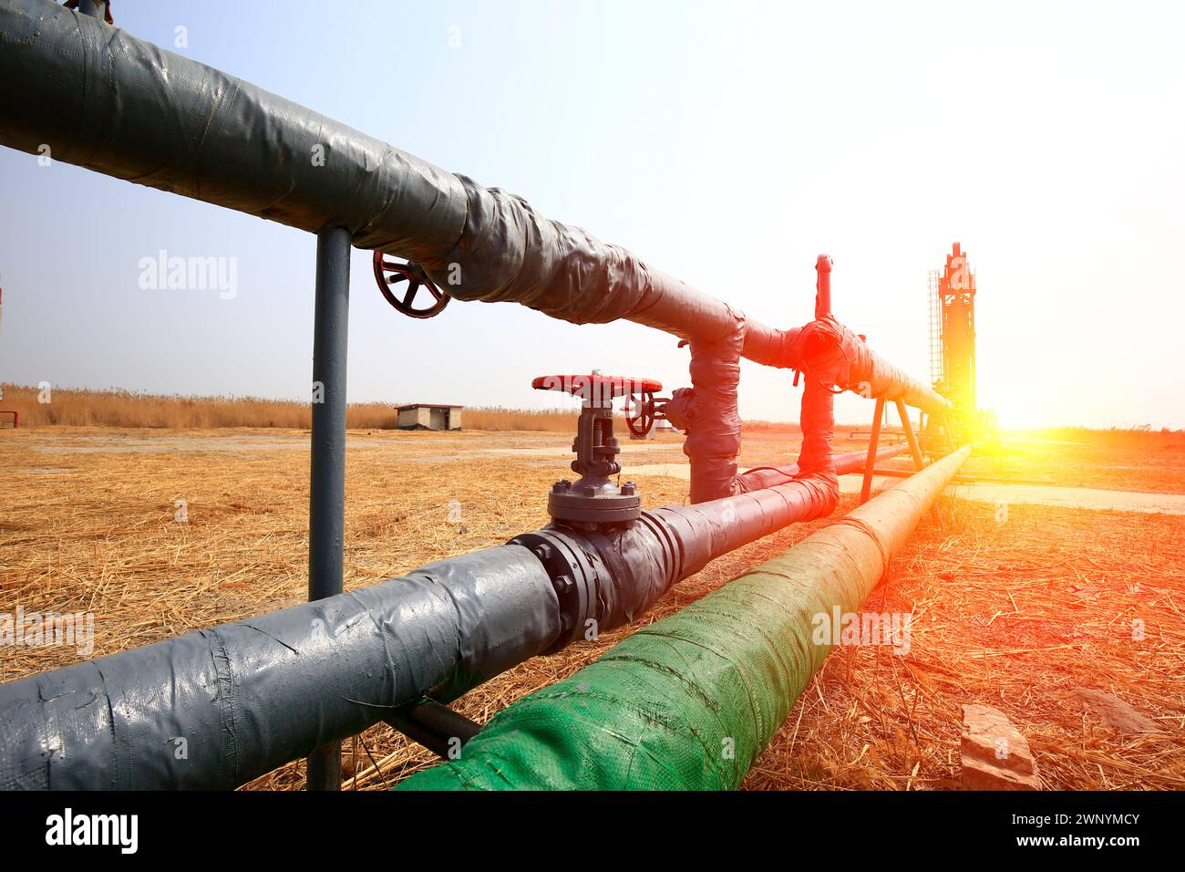 Oil pipes and valves Stock Photo - Alamy