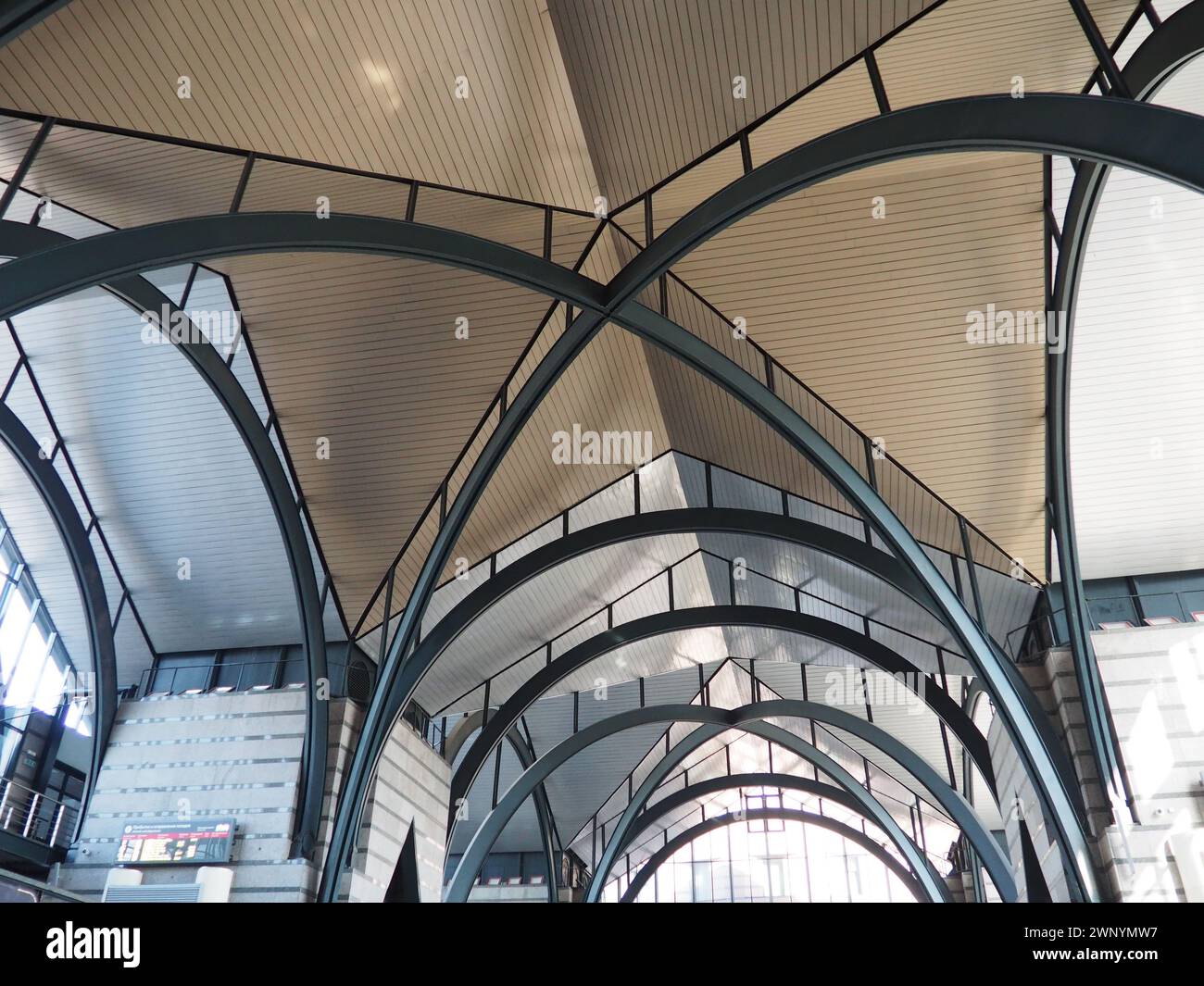 Arches and arches of the station. Metal structures under the roof of a ...