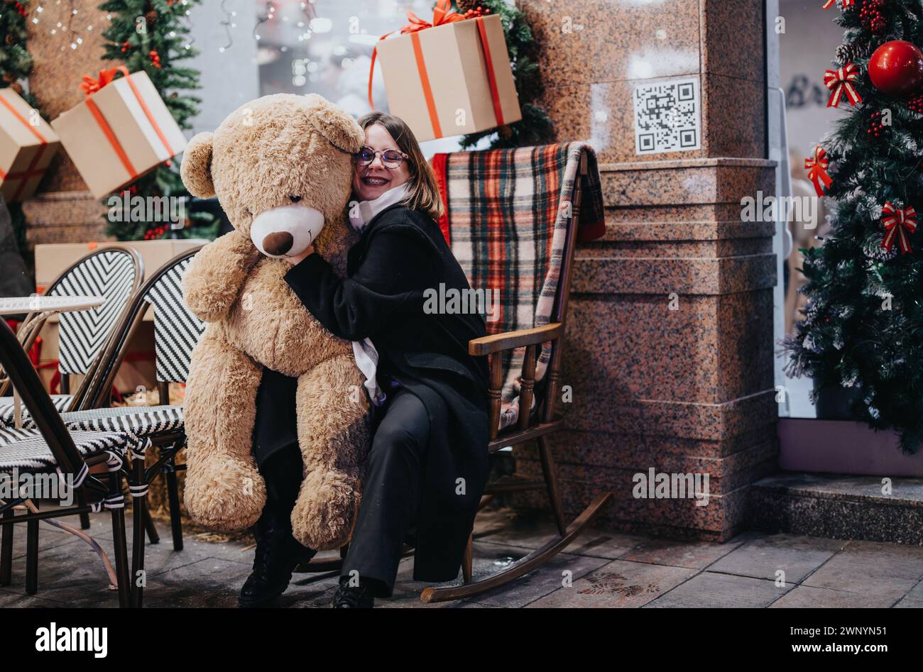 Girl hugging giant teddy bear store