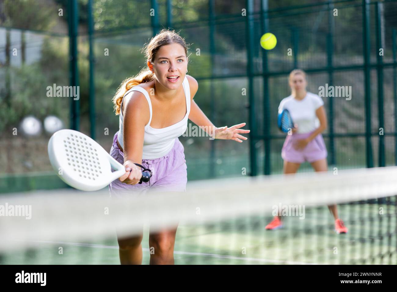 Woman padel tennis player training on court Stock Photo - Alamy