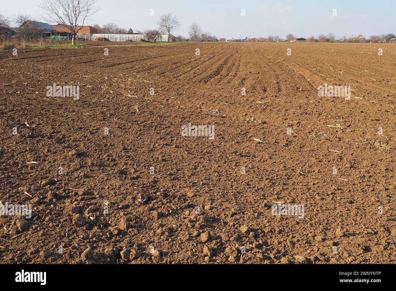 Arable field ready for spring agricultural work. Furrows from the ...