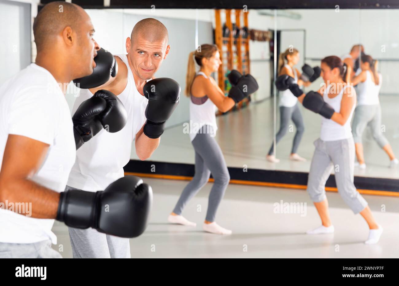 Two men practicing self defense techniques in sports club Stock Photo ...