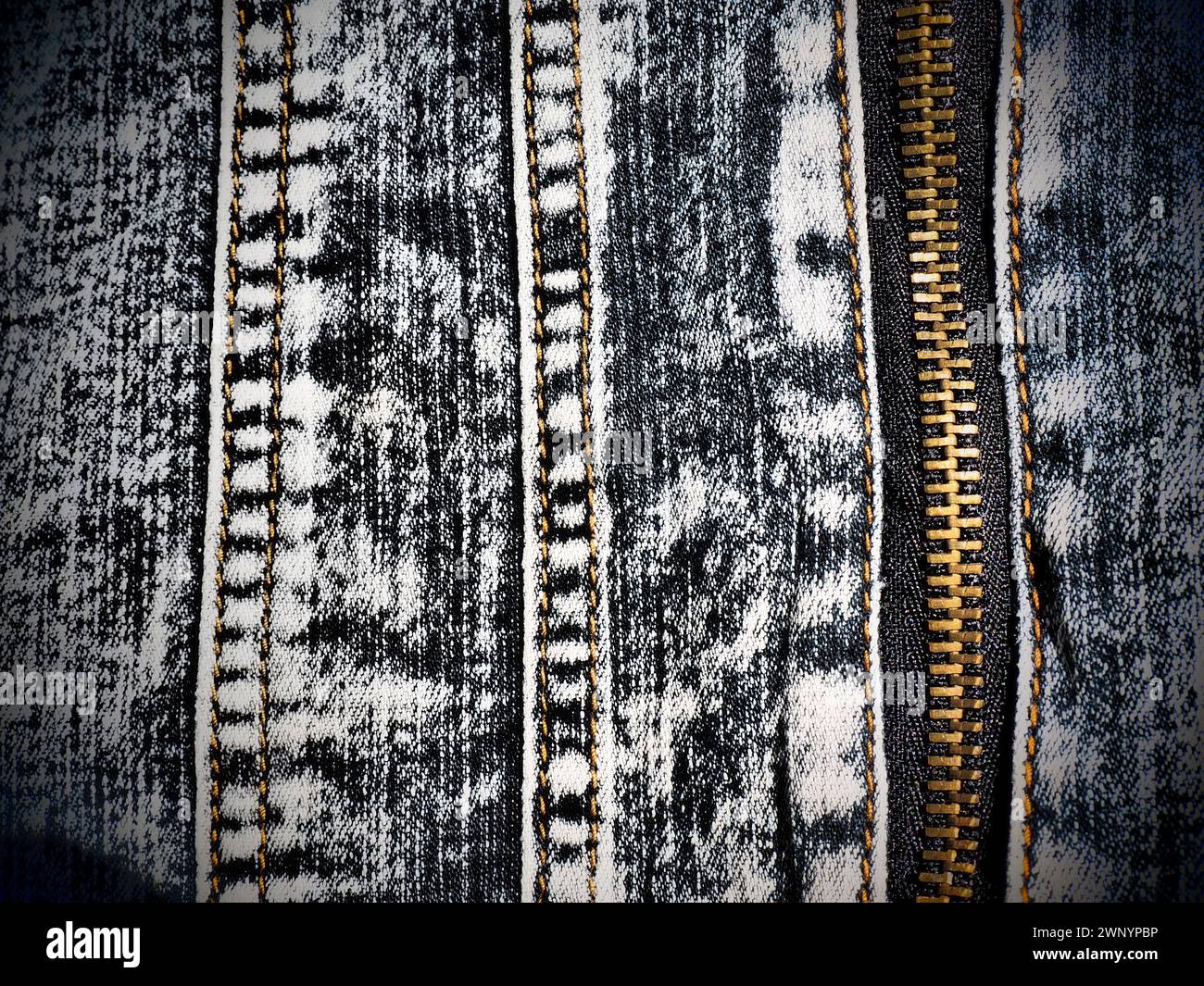 Close-up denim with seams and locks. Heavily shabby worn jeans. Metal ...
