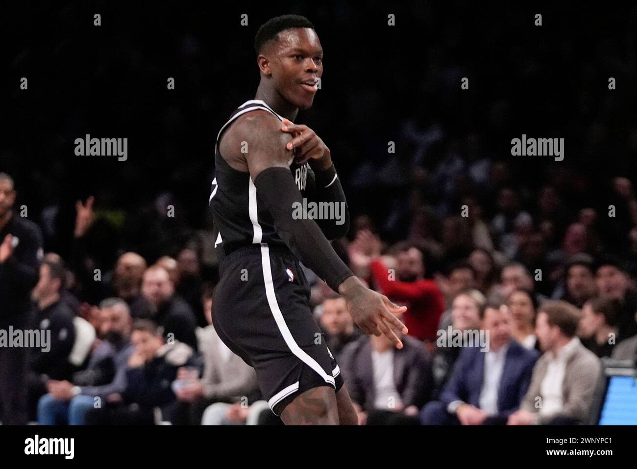 Brooklyn Nets' Dennis Schroder gestures after making a three point shot ...