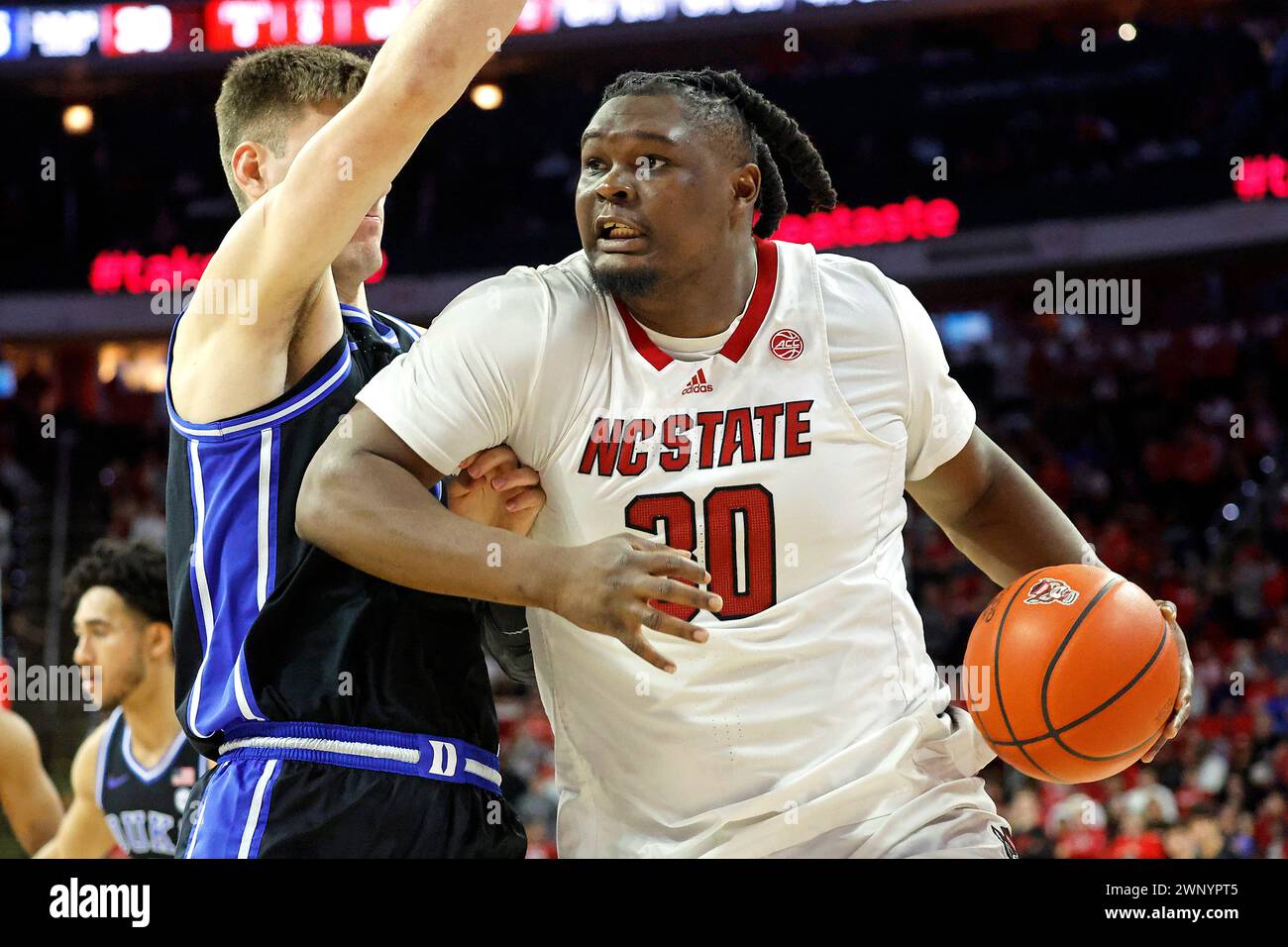 North Carolina State's DJ Burns Jr. (30) drives the ball into Duke's ...