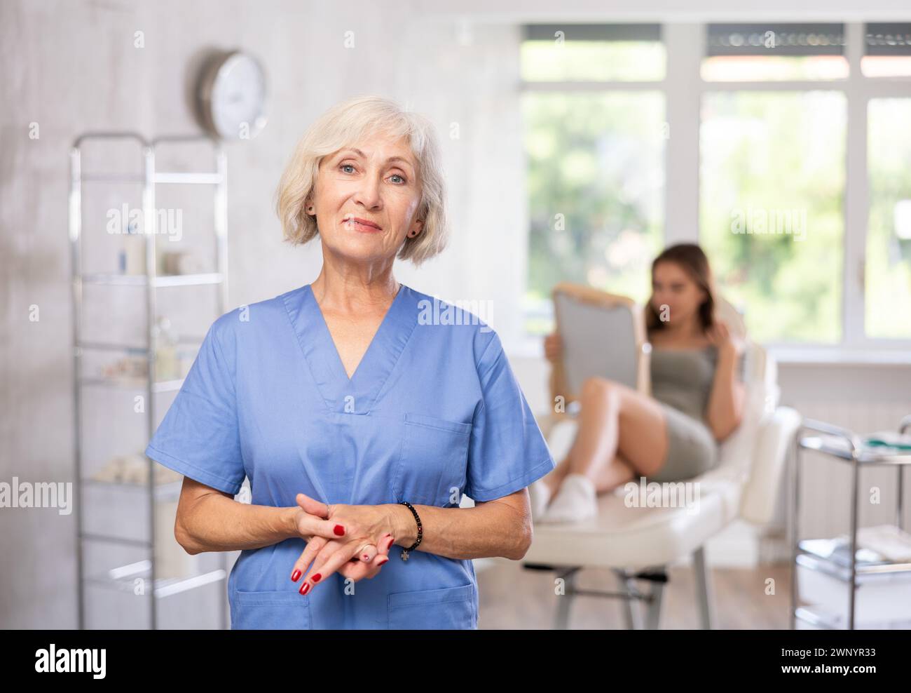 Elderly female doctor portrait Stock Photo - Alamy