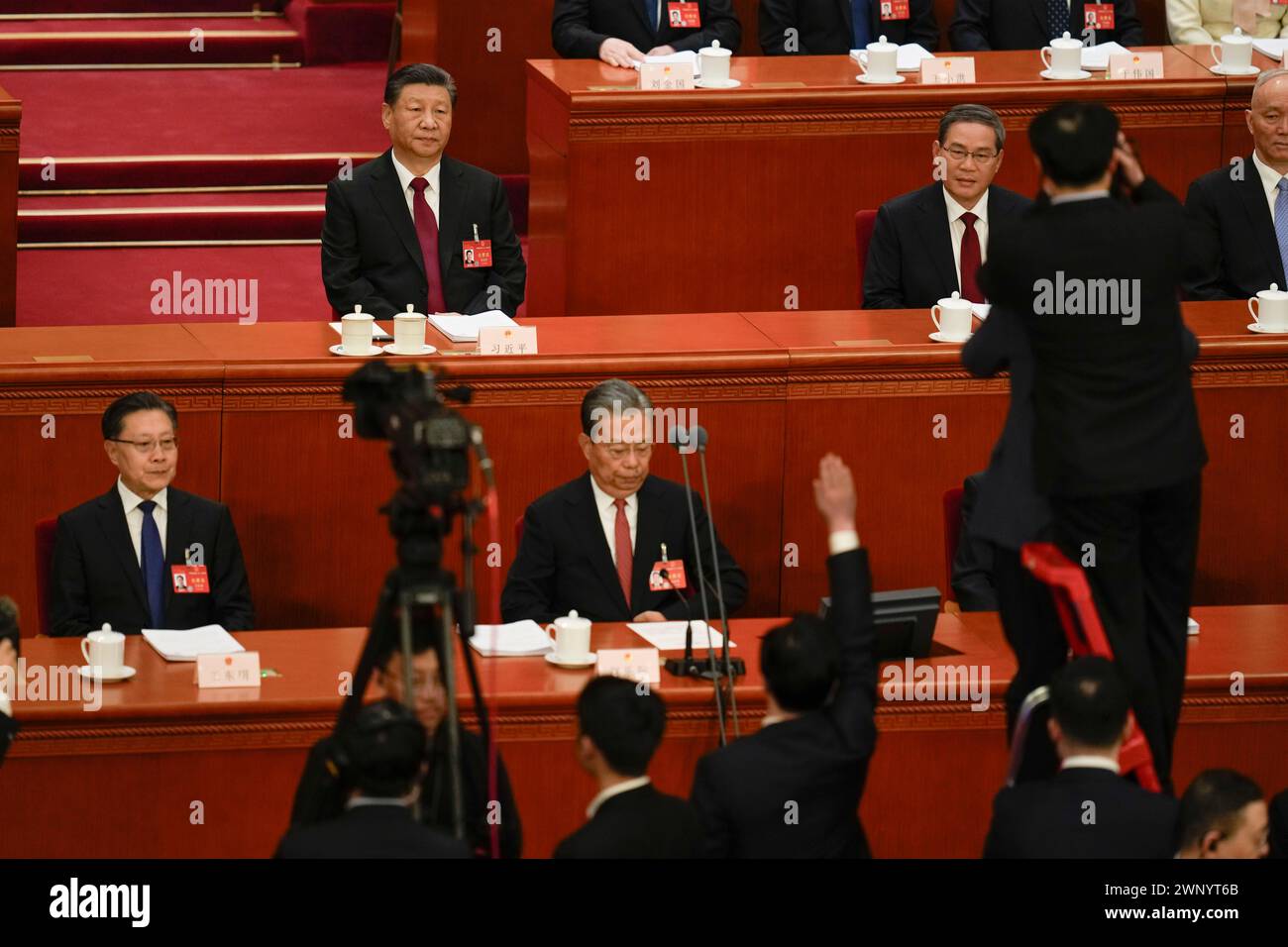 Chinese President Xi Jinping, top left, and Chinese Premier Li Qiang ...