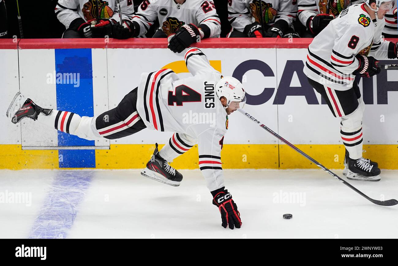Chicago Blackhawks defenseman Seth Jones flies on to the ice after ...