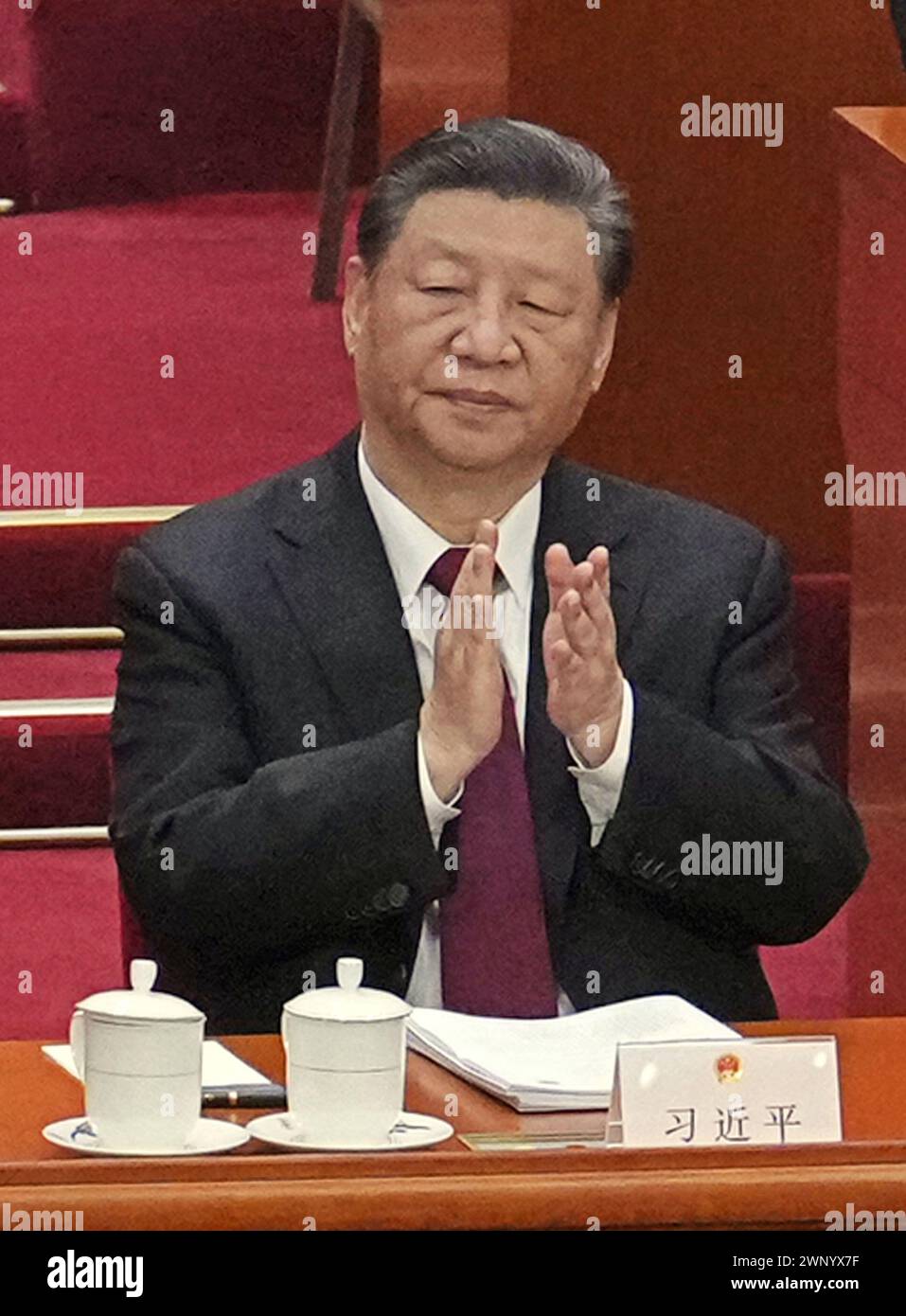 Beijing, China. 05th Mar, 2024. Chinese President Xi Jinping claps ...