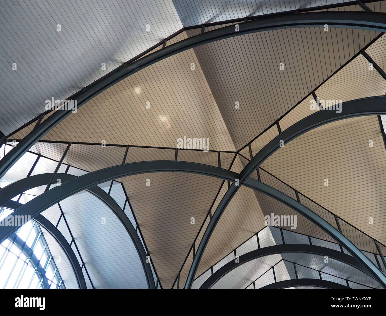 Arches and arches of the station. Metal structures under the roof of a ...