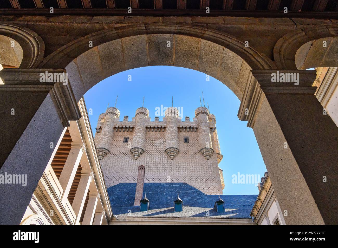 Tower framed in arch and columns. Architectural feature in the Segovia ...
