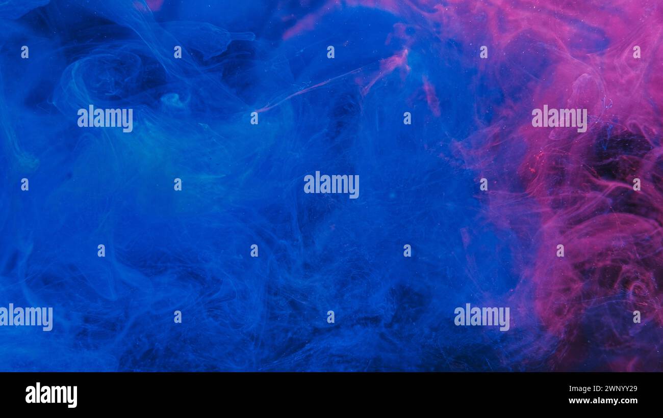 Glitter mist texture color smoke blue pink ink Stock Photo - Alamy