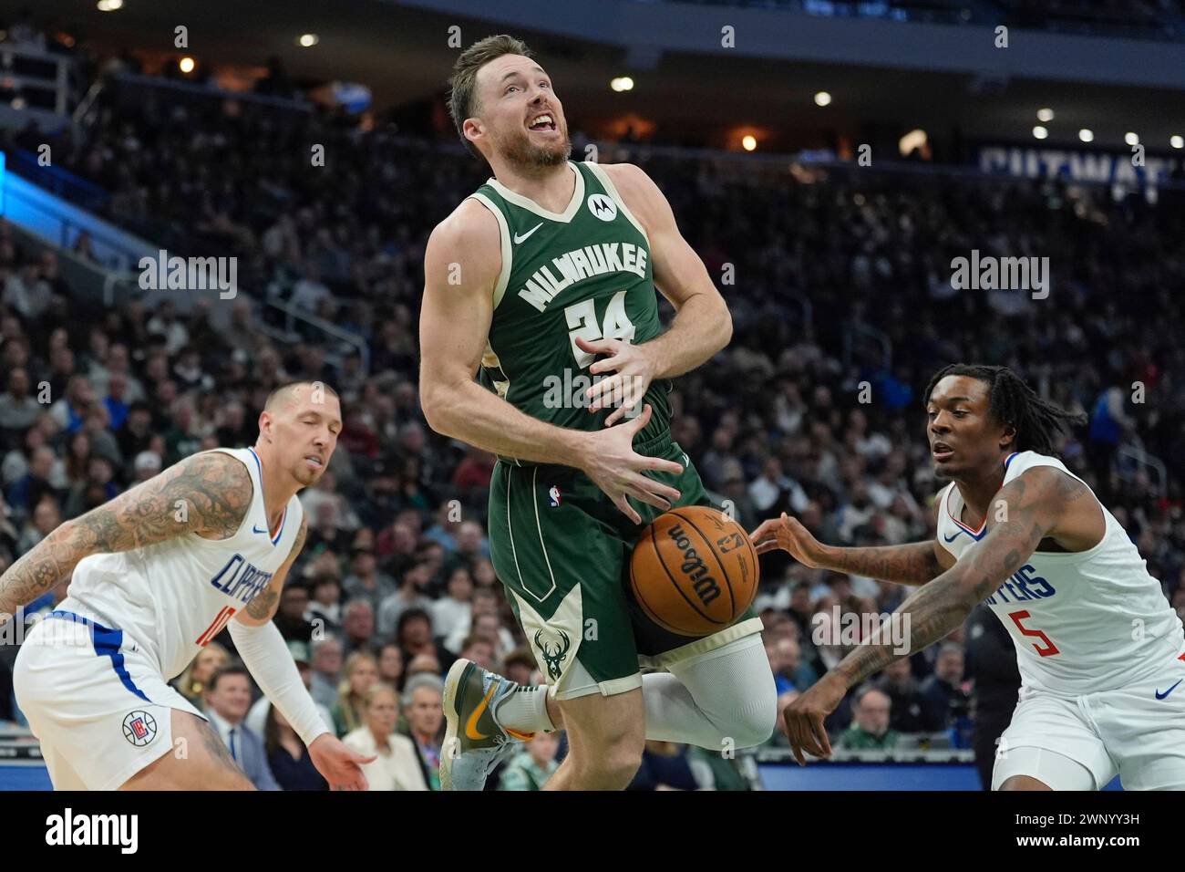 Los Angeles Clippers' Bones Hyland fouls Milwaukee Bucks' Pat ...