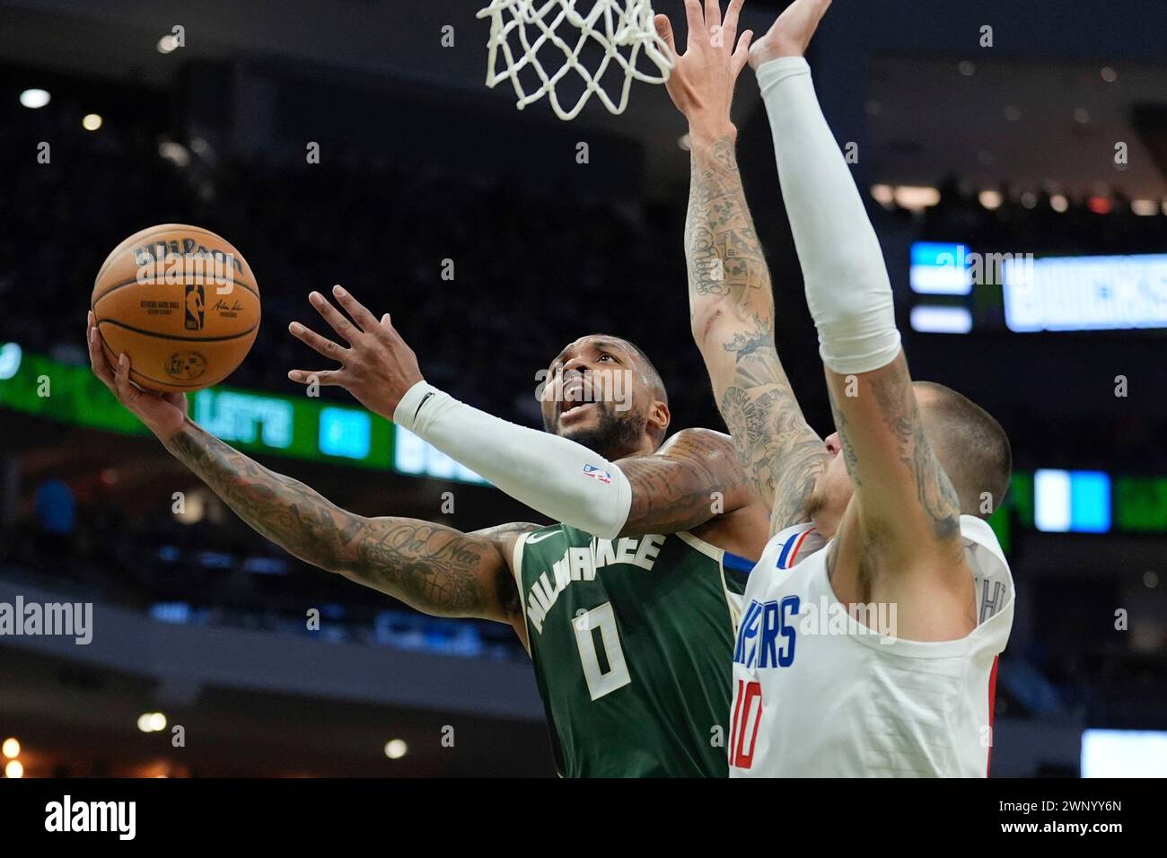 Milwaukee Bucks' Damian Lillard shoots past Los Angeles Clippers ...
