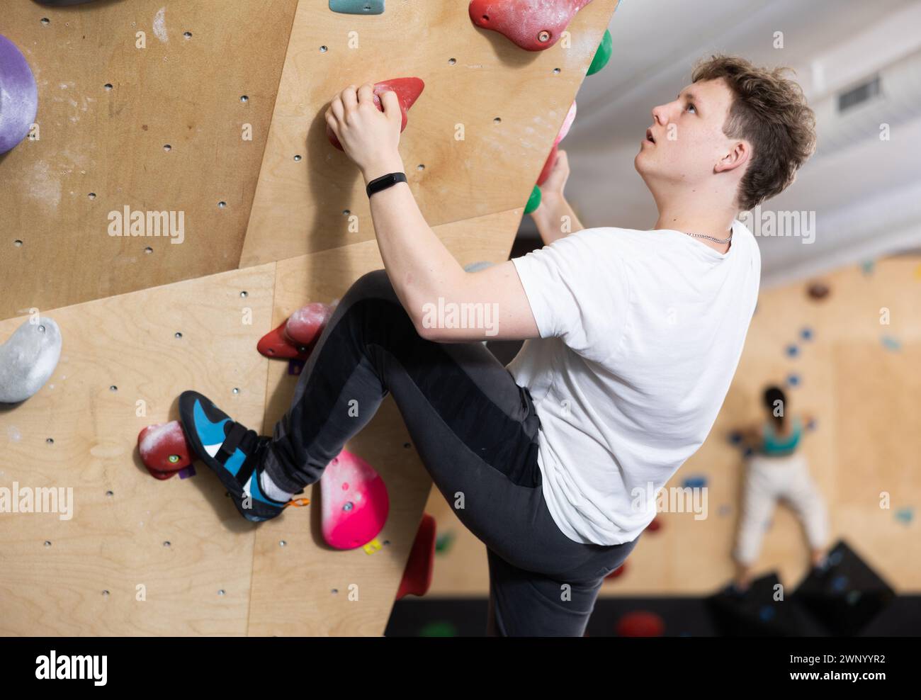Teenager rock climbing wall hi-res stock photography and images - Alamy