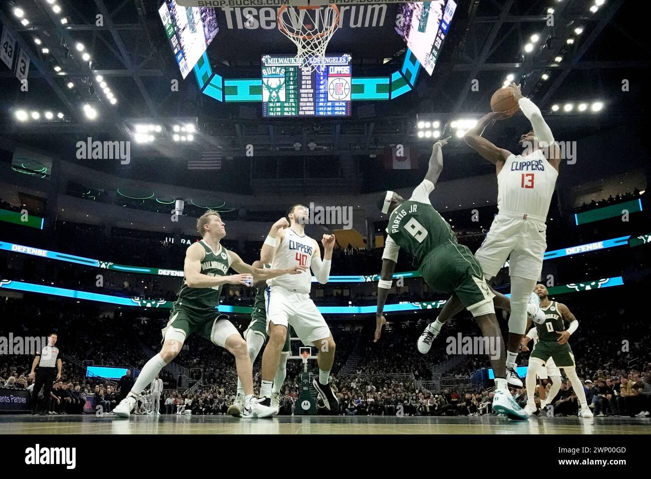 Los Angeles Clippers' Paul George shoots over Milwaukee Bucks' Bobby ...