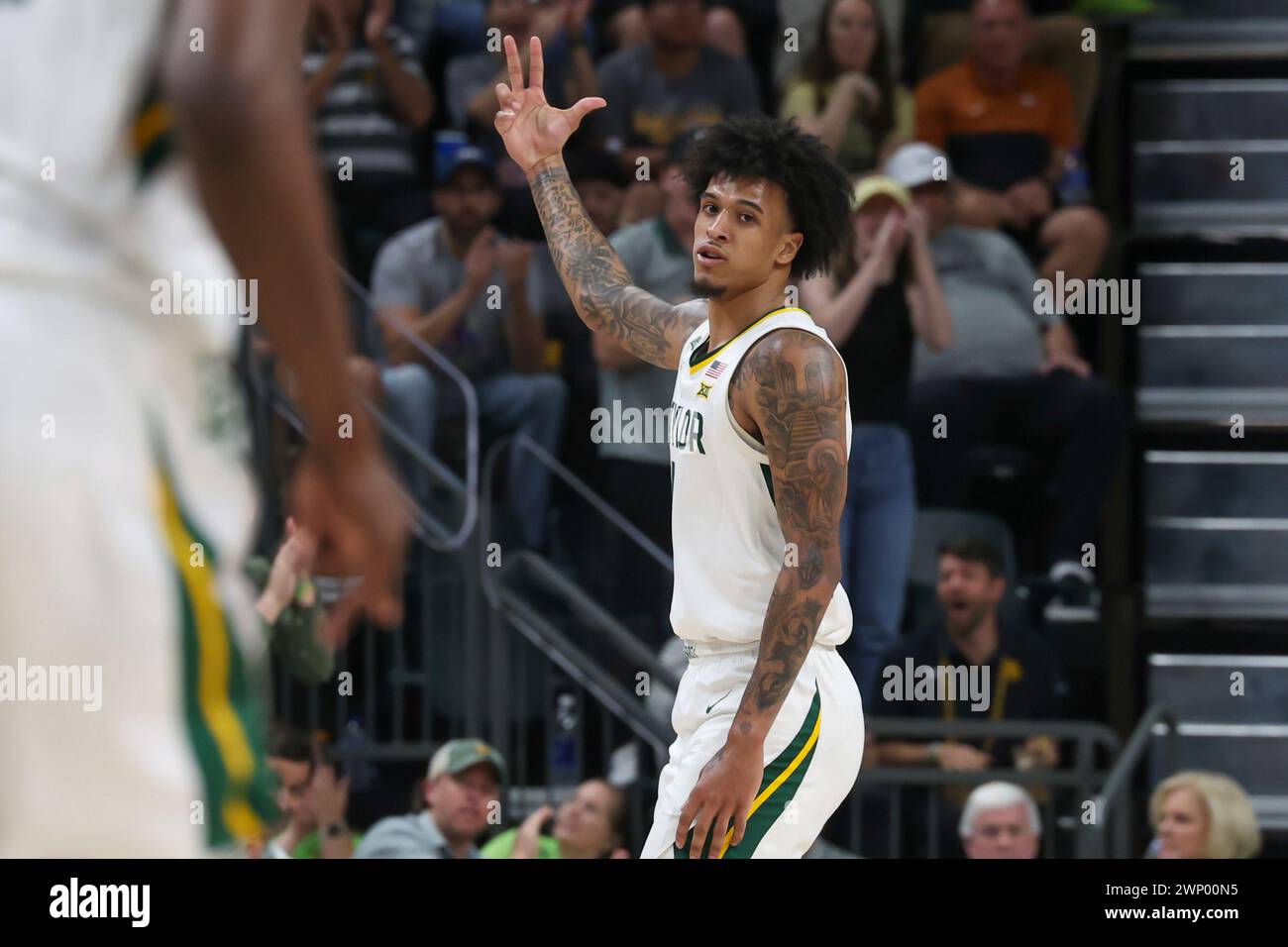 WACO, TX - MARCH 04: Baylor Bears forward Jalen Bridges (11) holds up a ...