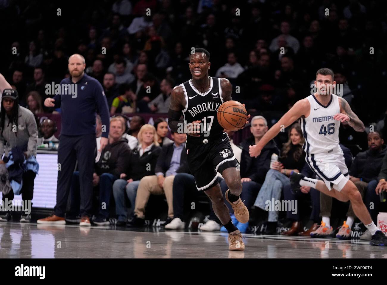 Brooklyn Nets' Dennis Schroder (17) drives past Memphis Grizzlies' John ...