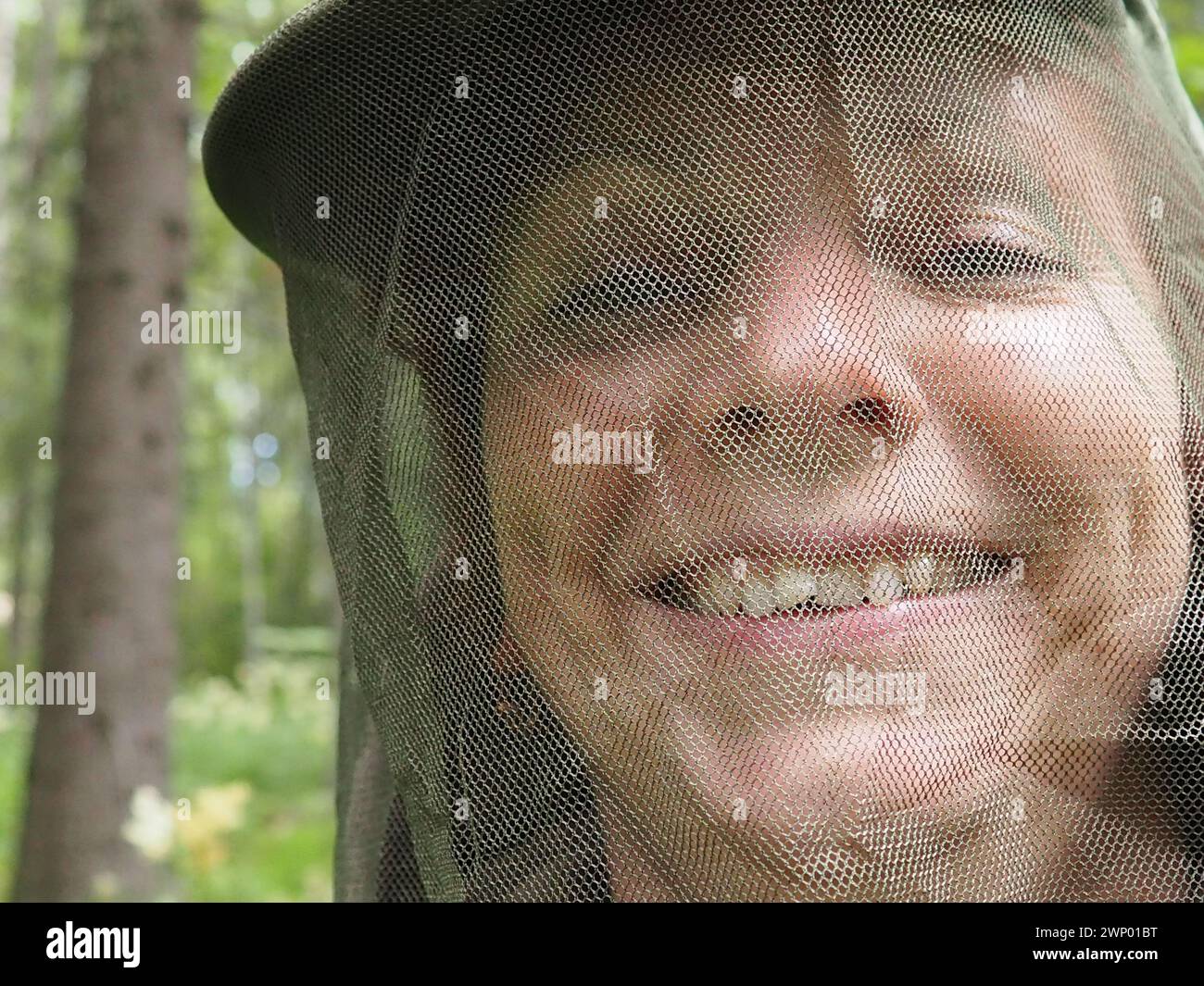 Woman wearing mosquito net hi-res stock photography and images - Alamy