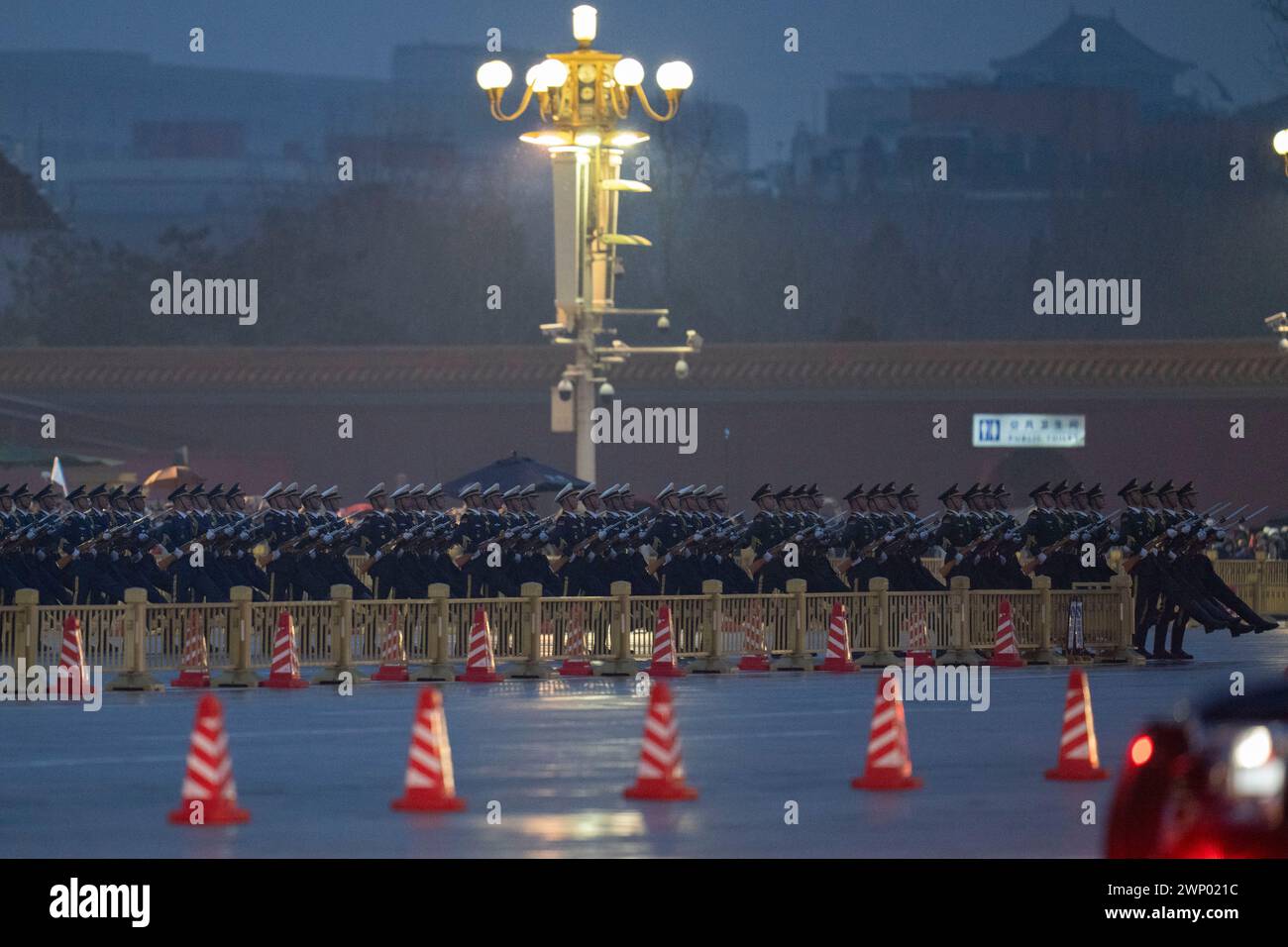 Members of a Chinese honor guard march to a flag raising ceremony ahead ...