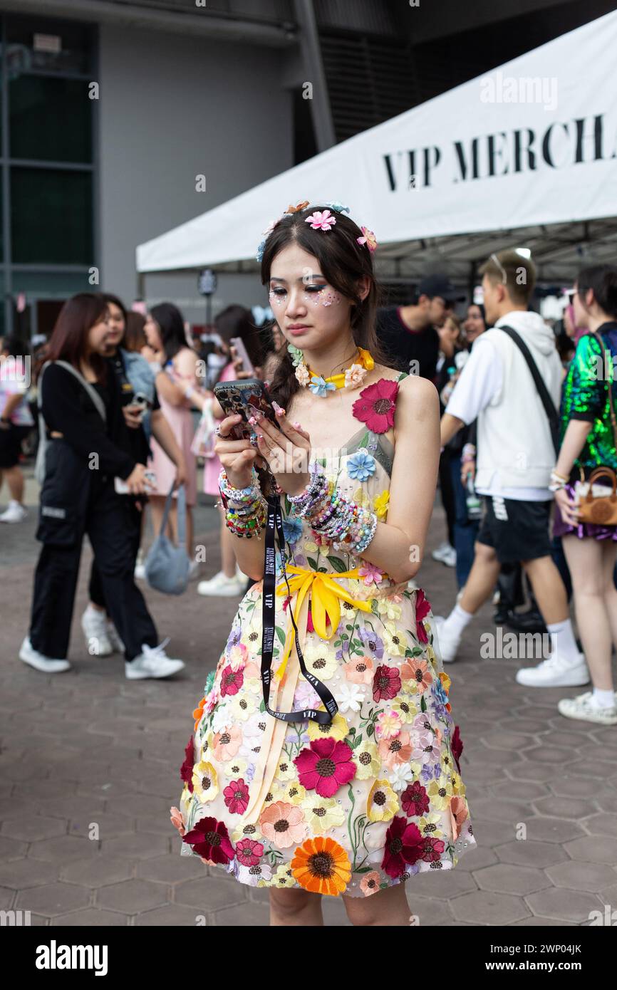 4th March 2024. A Chinese fan dress up in flowery pattern dress. Taylor ...