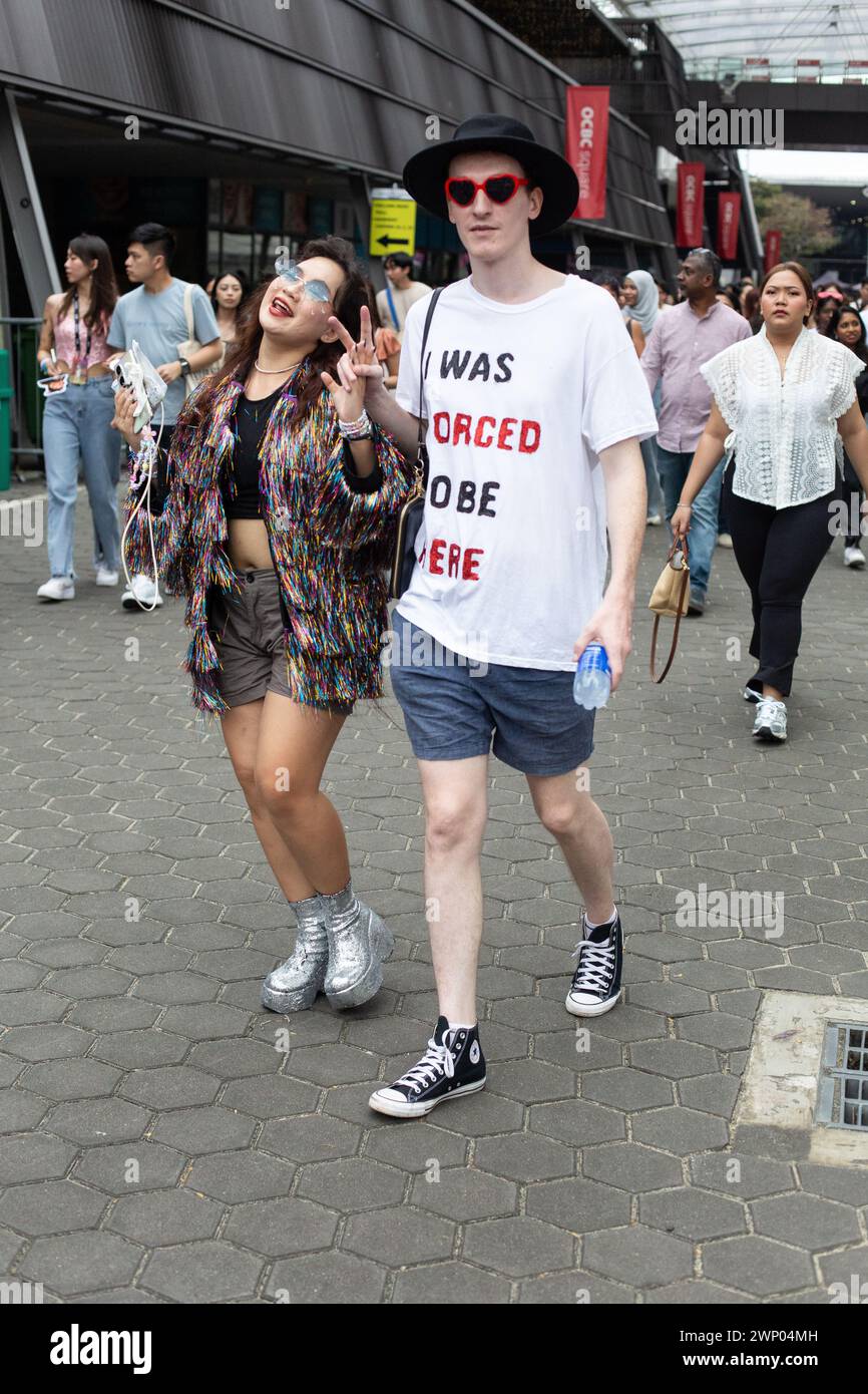 4th March 2024. Couple fans walking and posing for camera while heading ...