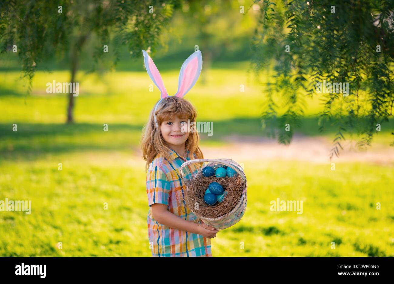 Happy Easter. Easter bunny children. Kids boy in bunny ears hunting ...
