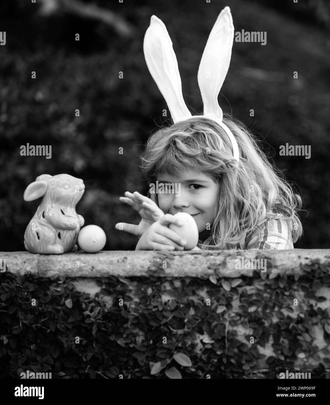 Happy easter day. Child with bunny ears. Children hunting easter eggs ...