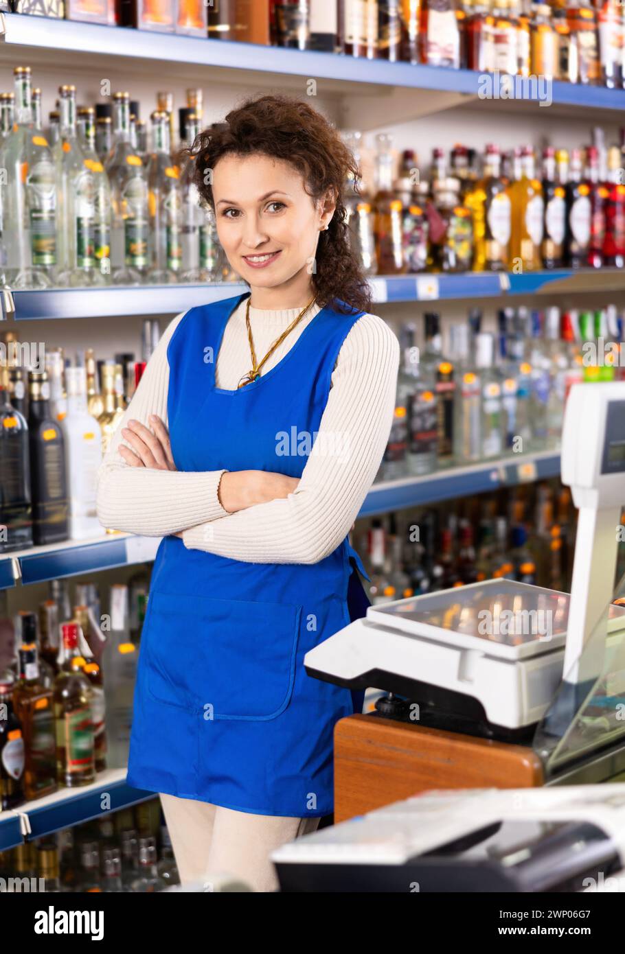 Woman works as salesperson in alcohol department of Russian store Stock ...