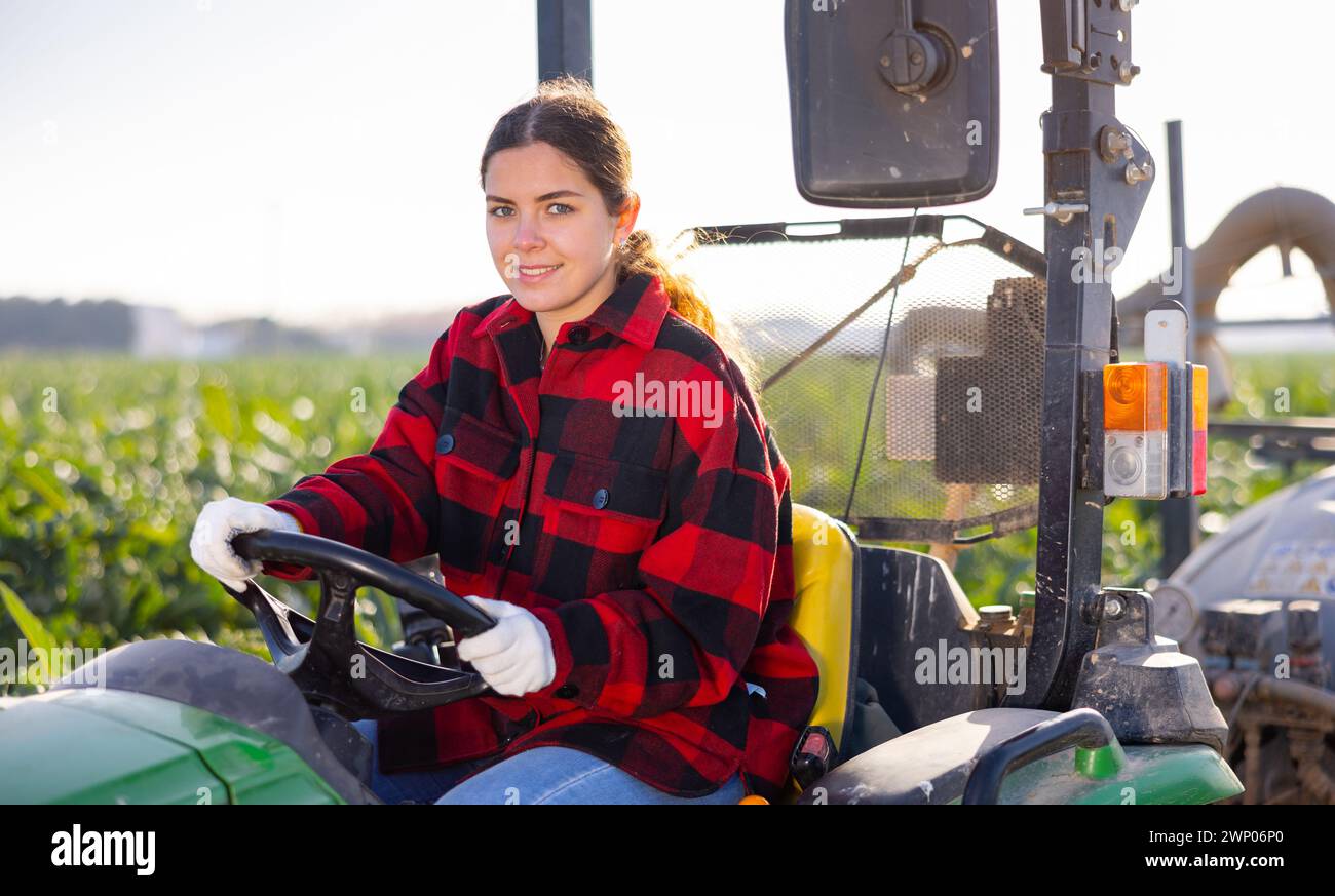 Woman driving tractor farm cabin hi-res stock photography and images ...