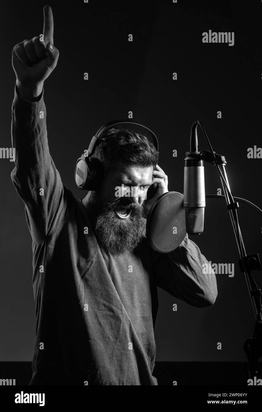 Man headphones music recording Black and White Stock Photos & Images ...