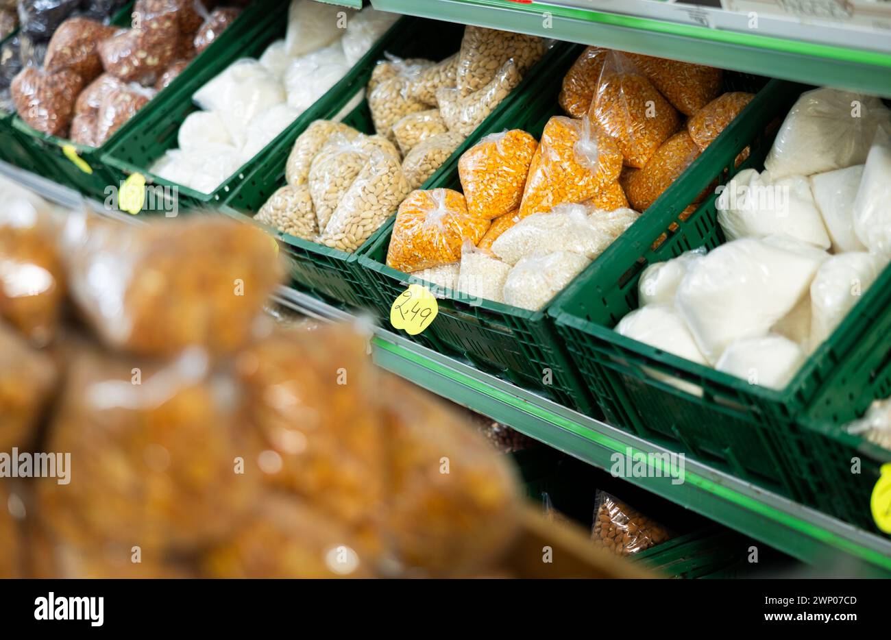 Various packaged bulk food products arranged on shelves in grocery ...