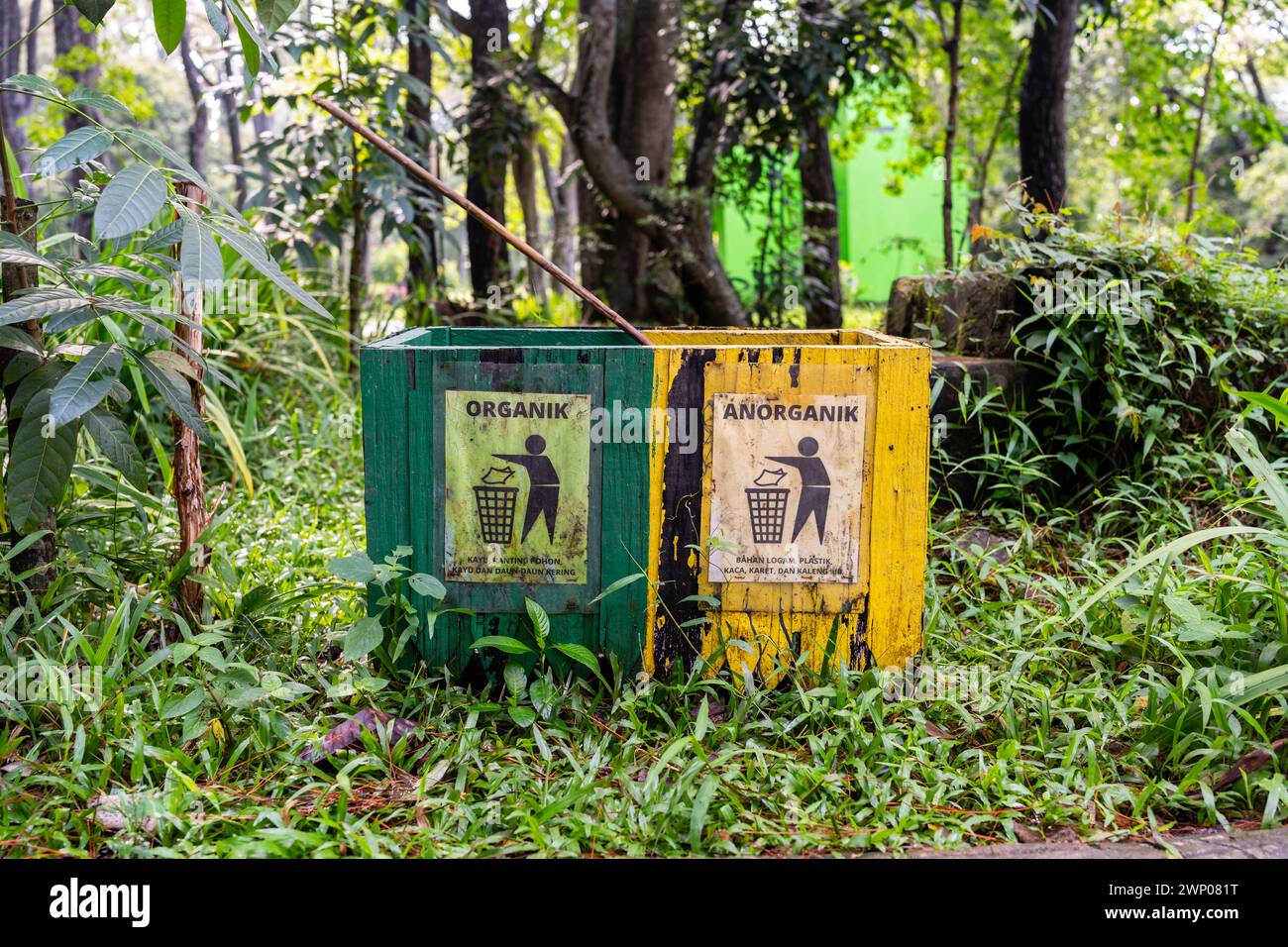 The trash cans in the Park are made of different colors, to ...