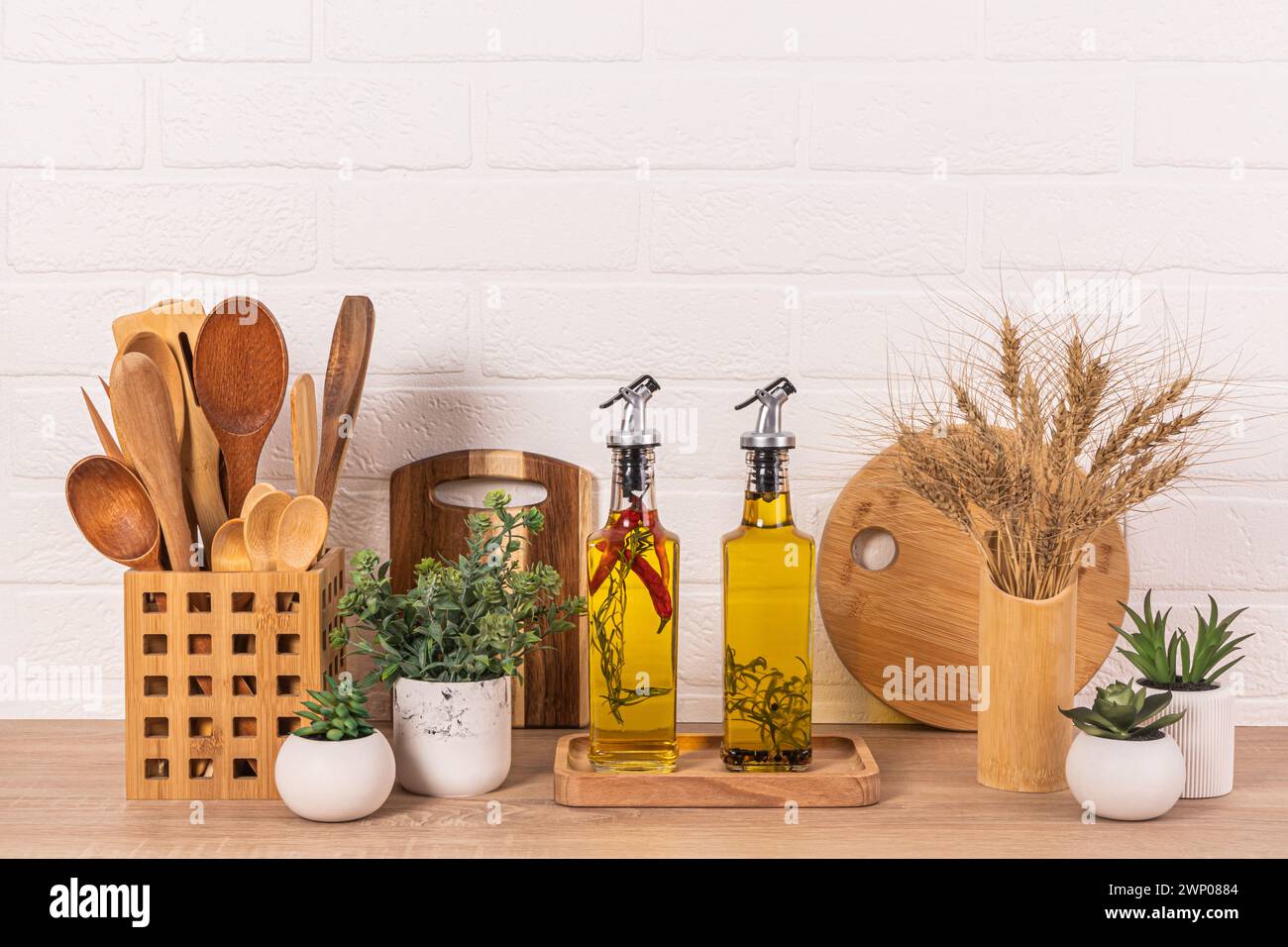 Stylish kitchen background with a set of bottles with various cooking ...