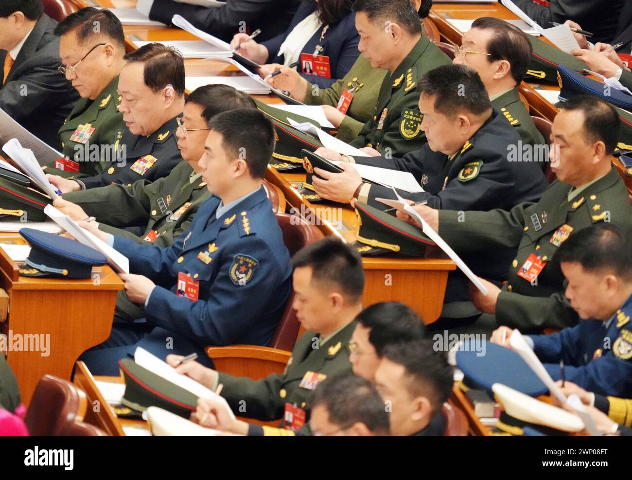 People's Liberation Army Ground Force members attend the National People's Congress (NPC) at the ...