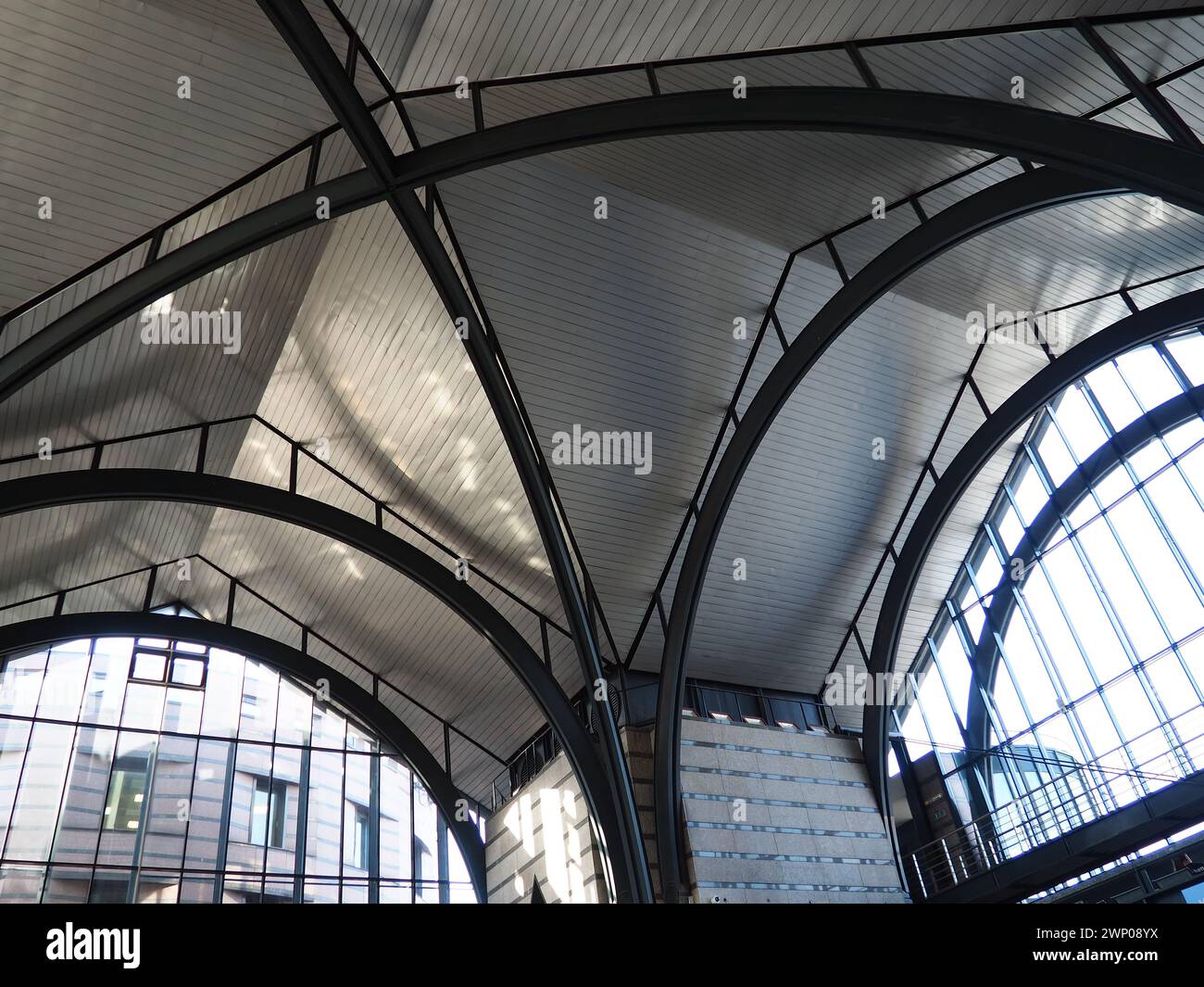 Arches and arches of the station. Metal structures under the roof of a ...