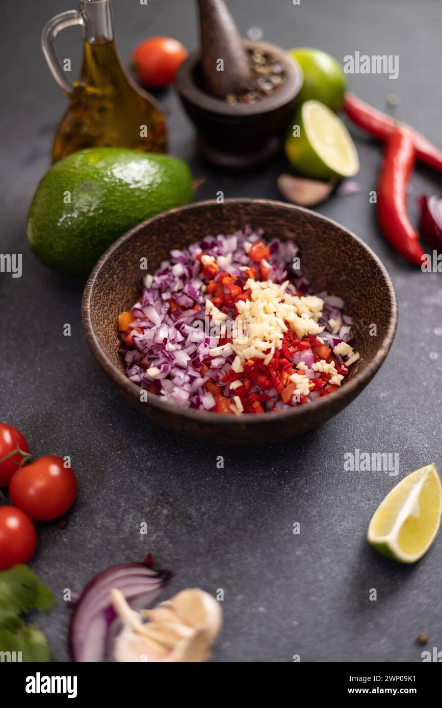 Cooking traditional salsa - sliced chopped ingredients in a wooden bowl ...