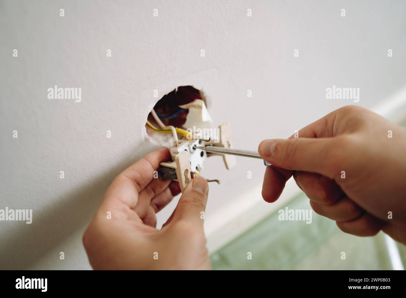 Installing socket hi-res stock photography and images - Alamy