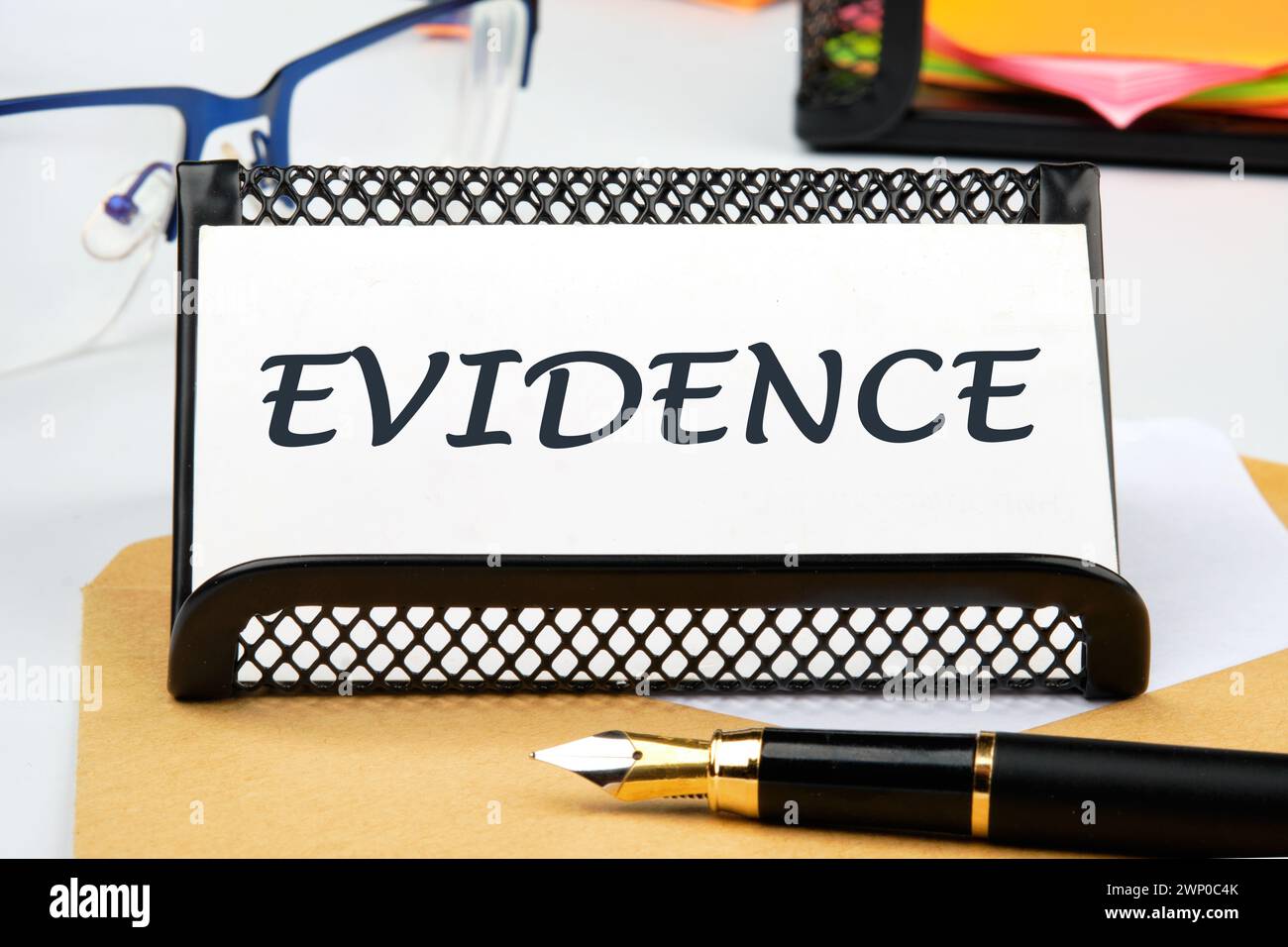Word Evidence written on a business card on the table Stock Photo - Alamy