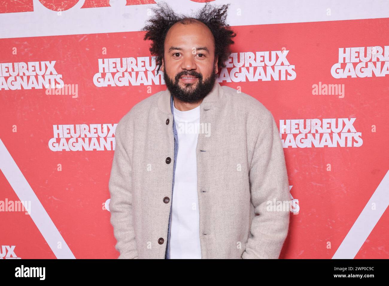Fabrice Eboue attends the photocall for the film Heureux Gagnants held ...