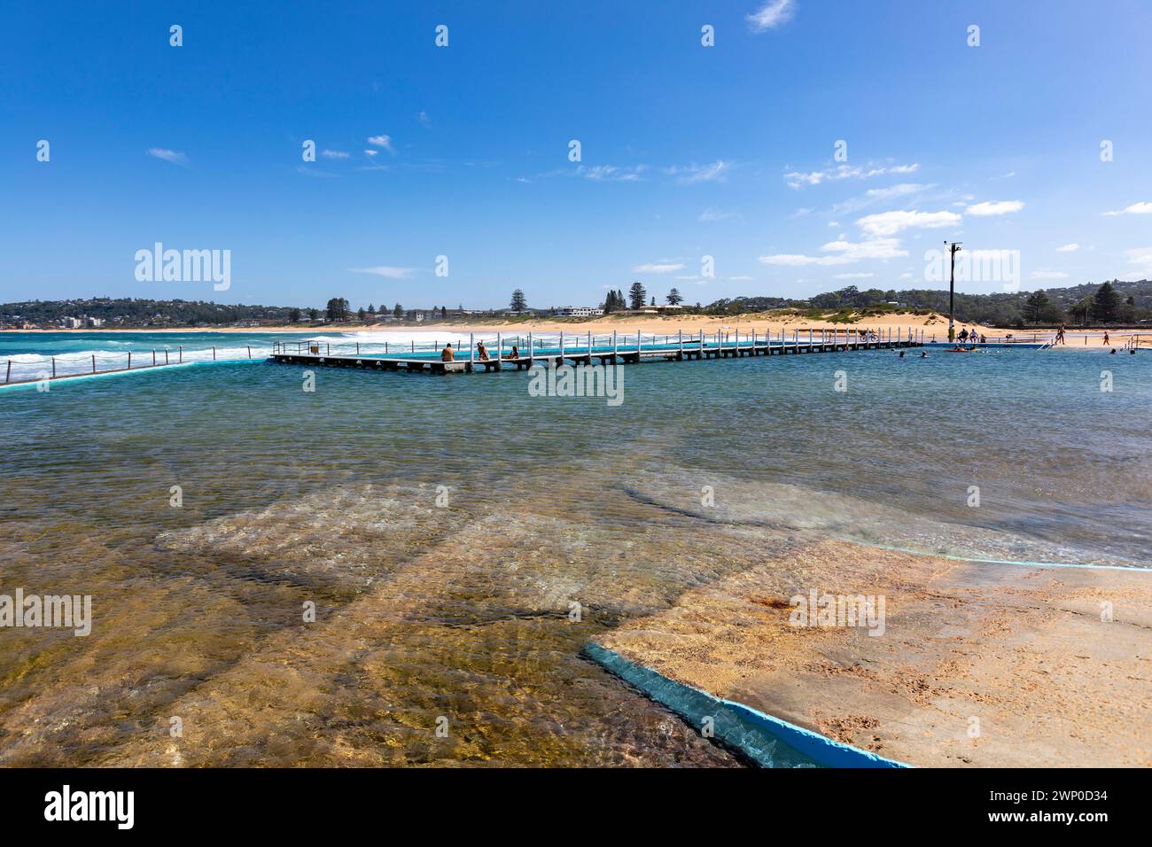Narrabeen beach ocean pool rockpool on a blue sky autumn day in 2024 ...