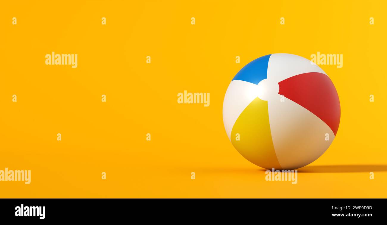 Inflatable beach ball on yellow summer background. Summer holiday ...