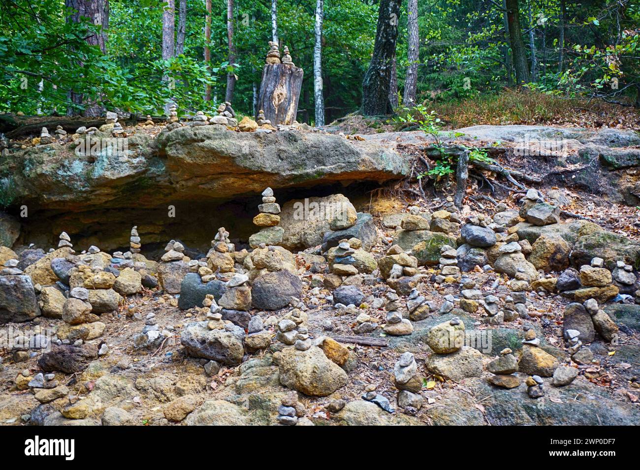 boulder cairn in the forest in the forest Stock Photo - Alamy