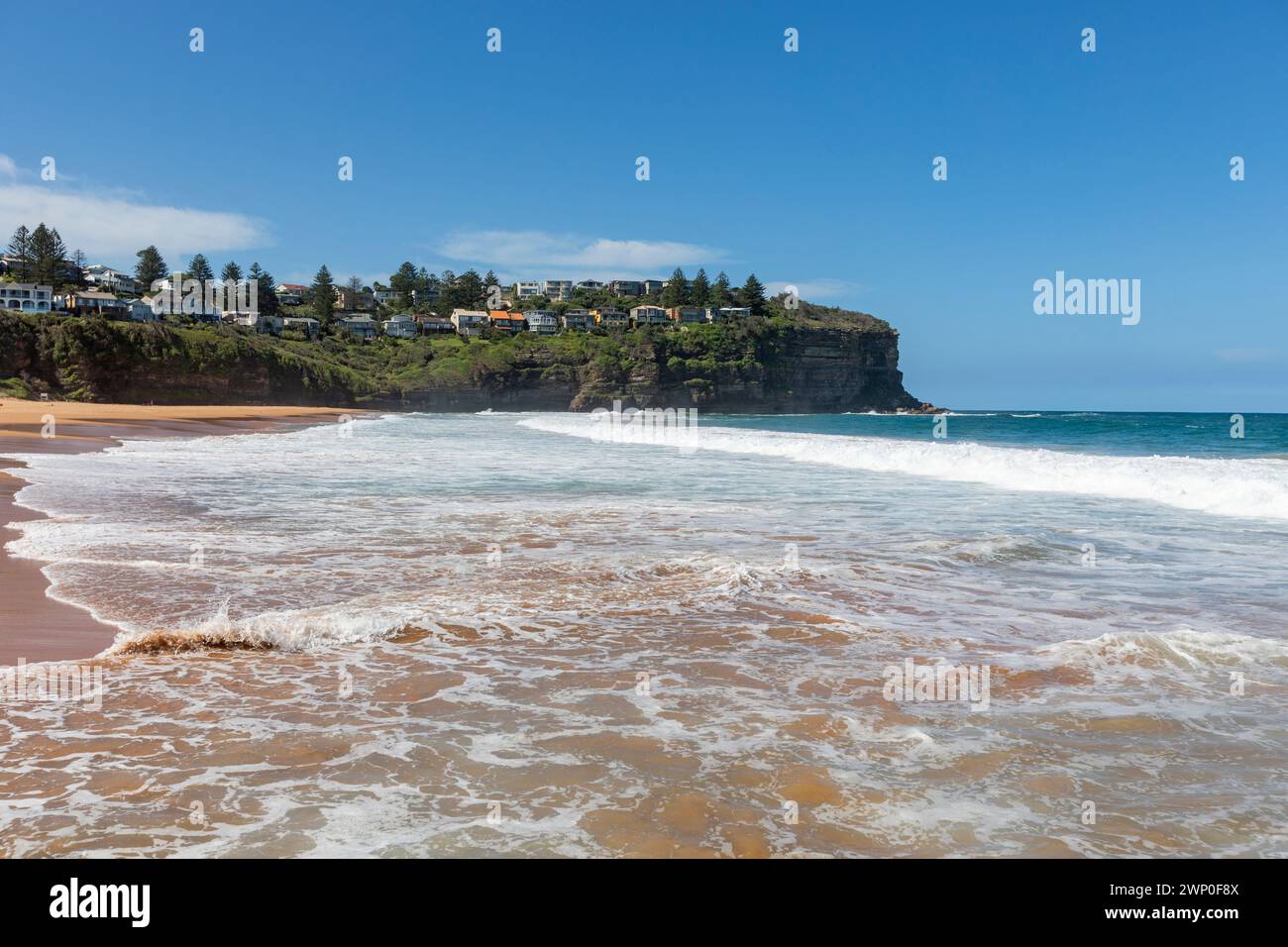 Bilgola Beach, one of Sydney's famous northern beaches, blue sky autumn ...