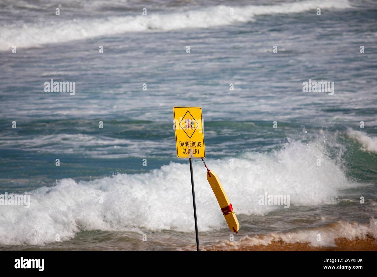 Dangerous current warning yellow sign on Narrabeen beach in Sydney,NSW ...