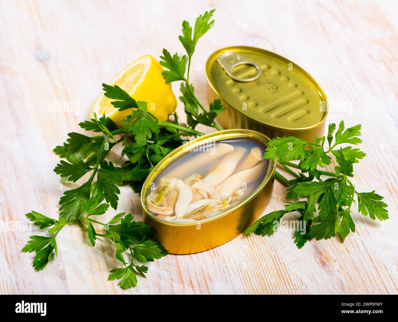 Preserved natural ensis with herbs and lemon Stock Photo - Alamy