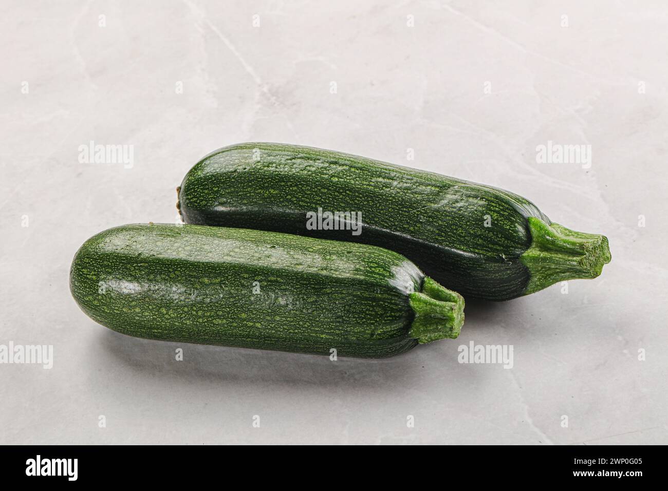 Raw green ripe zucchini vegetable for cooking Stock Photo - Alamy